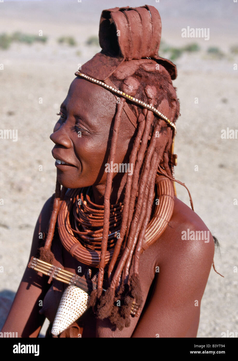Namibia, Kaokoland, Purros. A Himba woman in traditional attire. Her ...