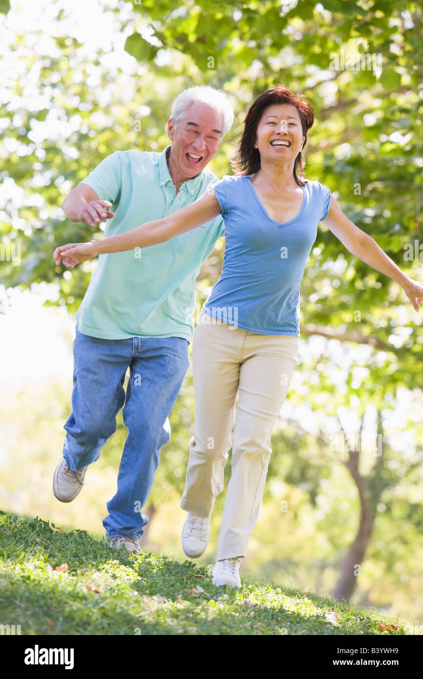 Woman fun baby running together hi-res stock photography and images - Alamy
