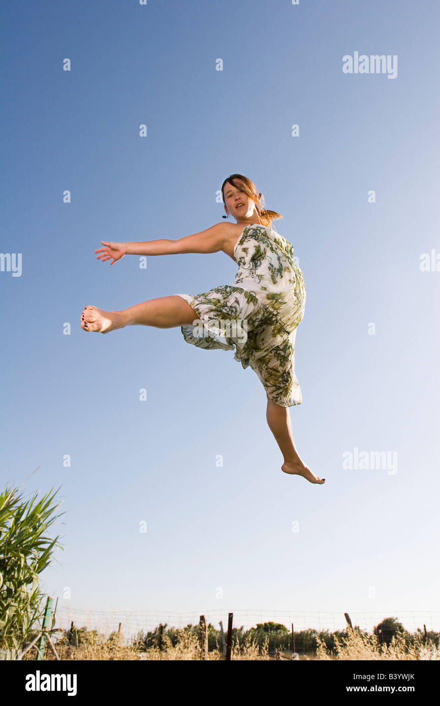 Girl jumping free air Stock Photo - Alamy
