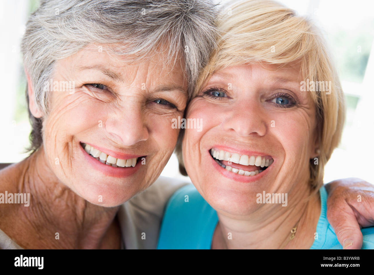 Two women sitting close hi-res stock photography and images - Alamy