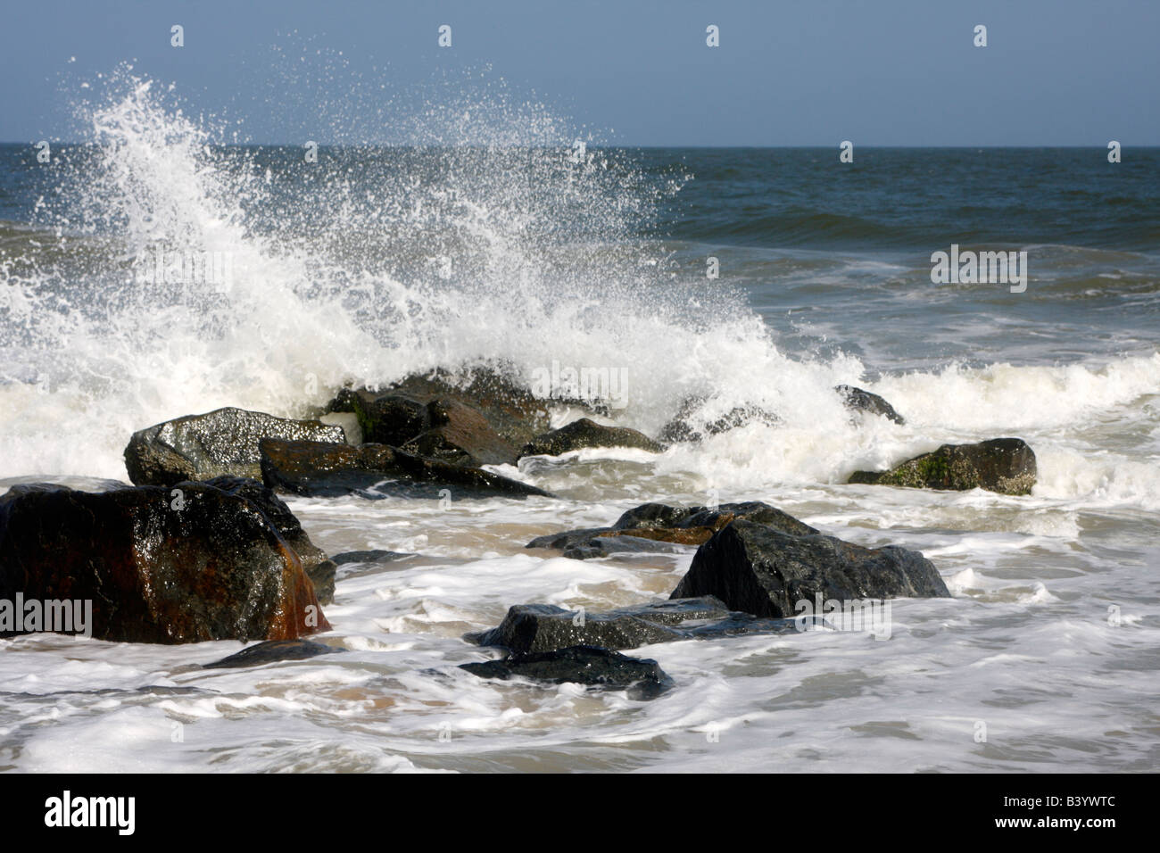 Waves breaking on rocks Stock Photo - Alamy