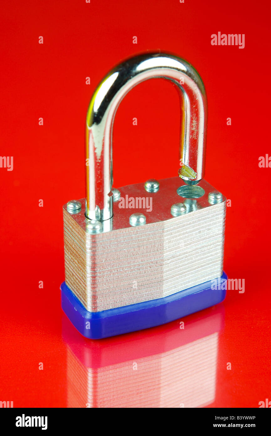 A padlock isolated against a red background Stock Photo - Alamy