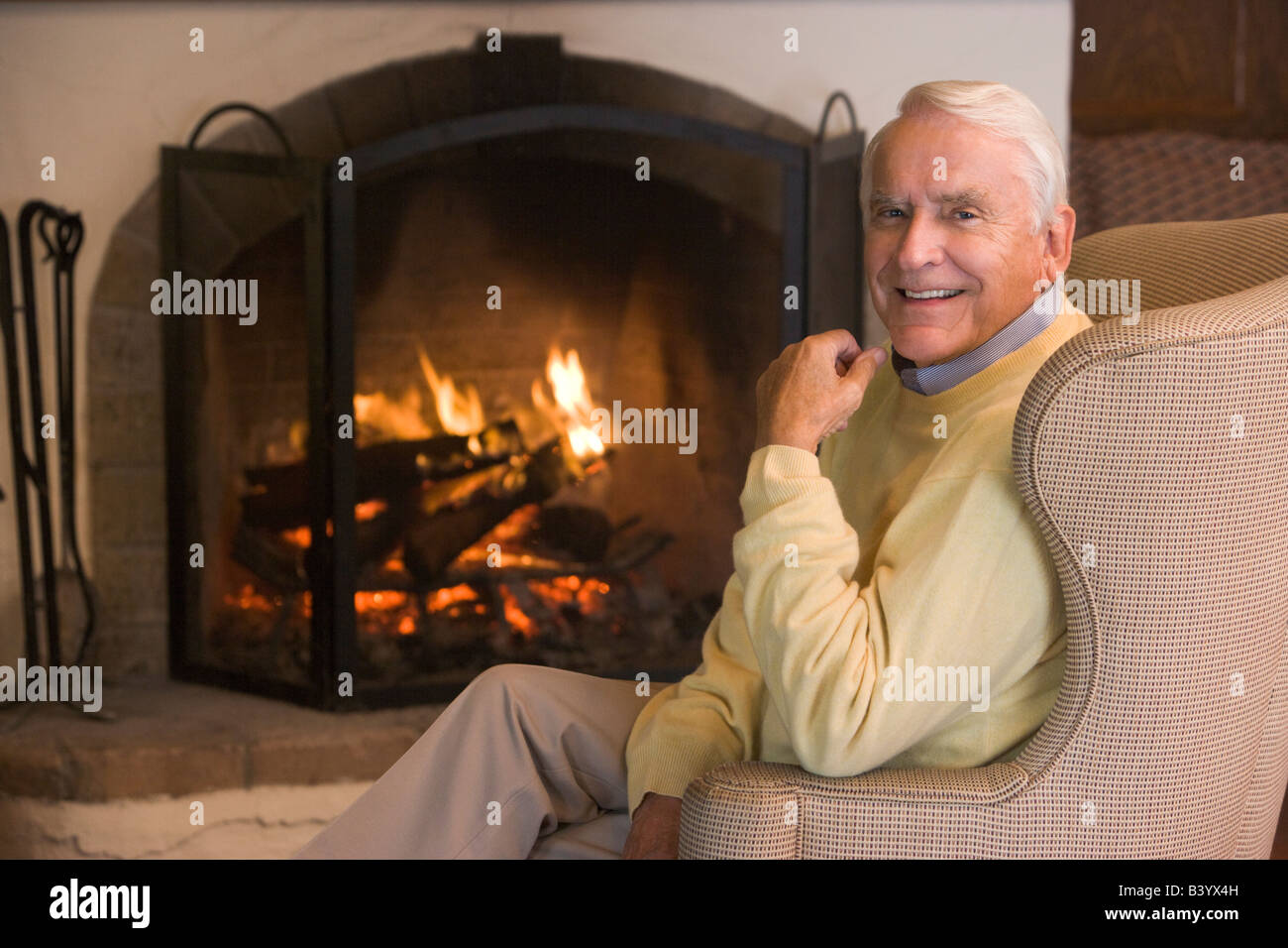 Man in living room smiling Stock Photo - Alamy