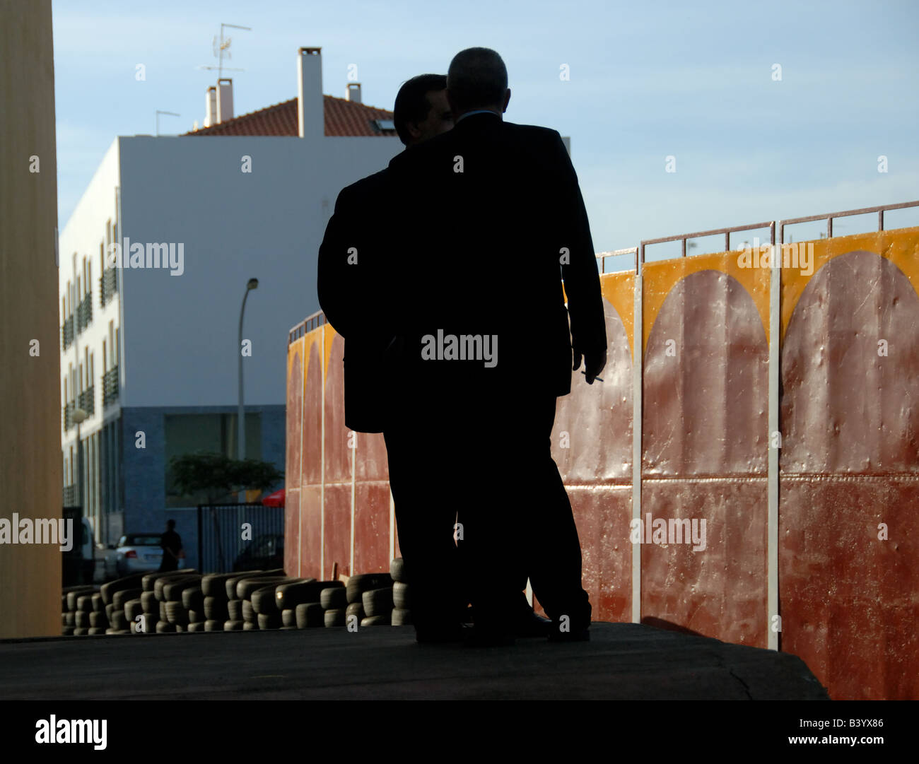 silhouetted men talking outside during agricultural fair Stock Photo ...