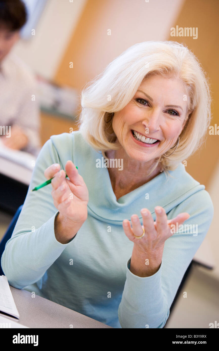 Adult student in class smiling (selective focus Stock Photo - Alamy