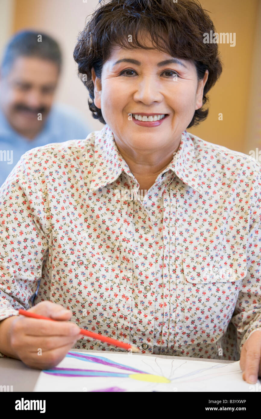Adult student in class drawing picture (selective focus Stock Photo - Alamy
