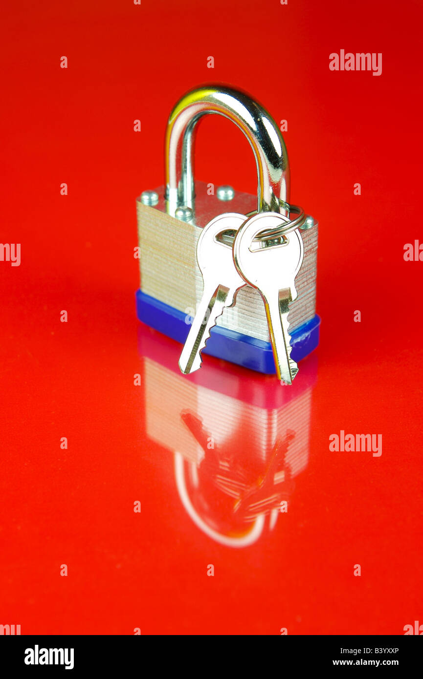 A padlock isolated against a red background Stock Photo - Alamy