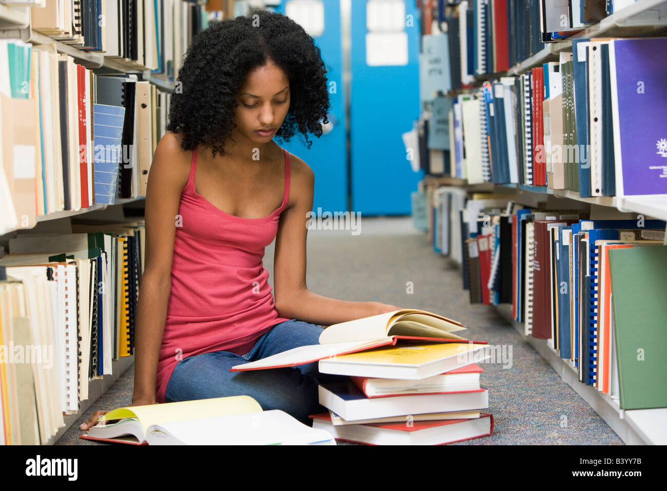 Woman Reading A Book In Library