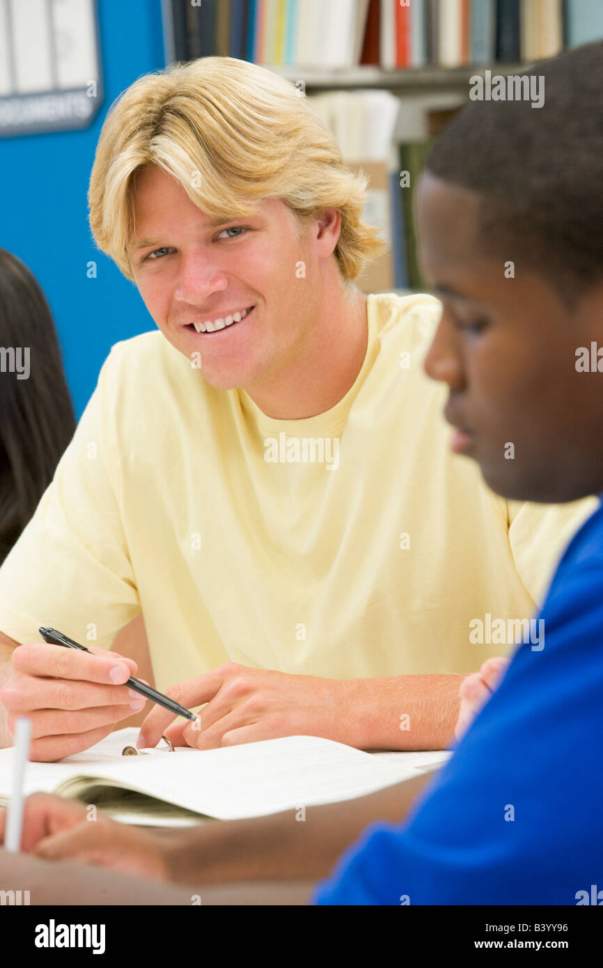 Three people in library studying (selective focus Stock Photo - Alamy