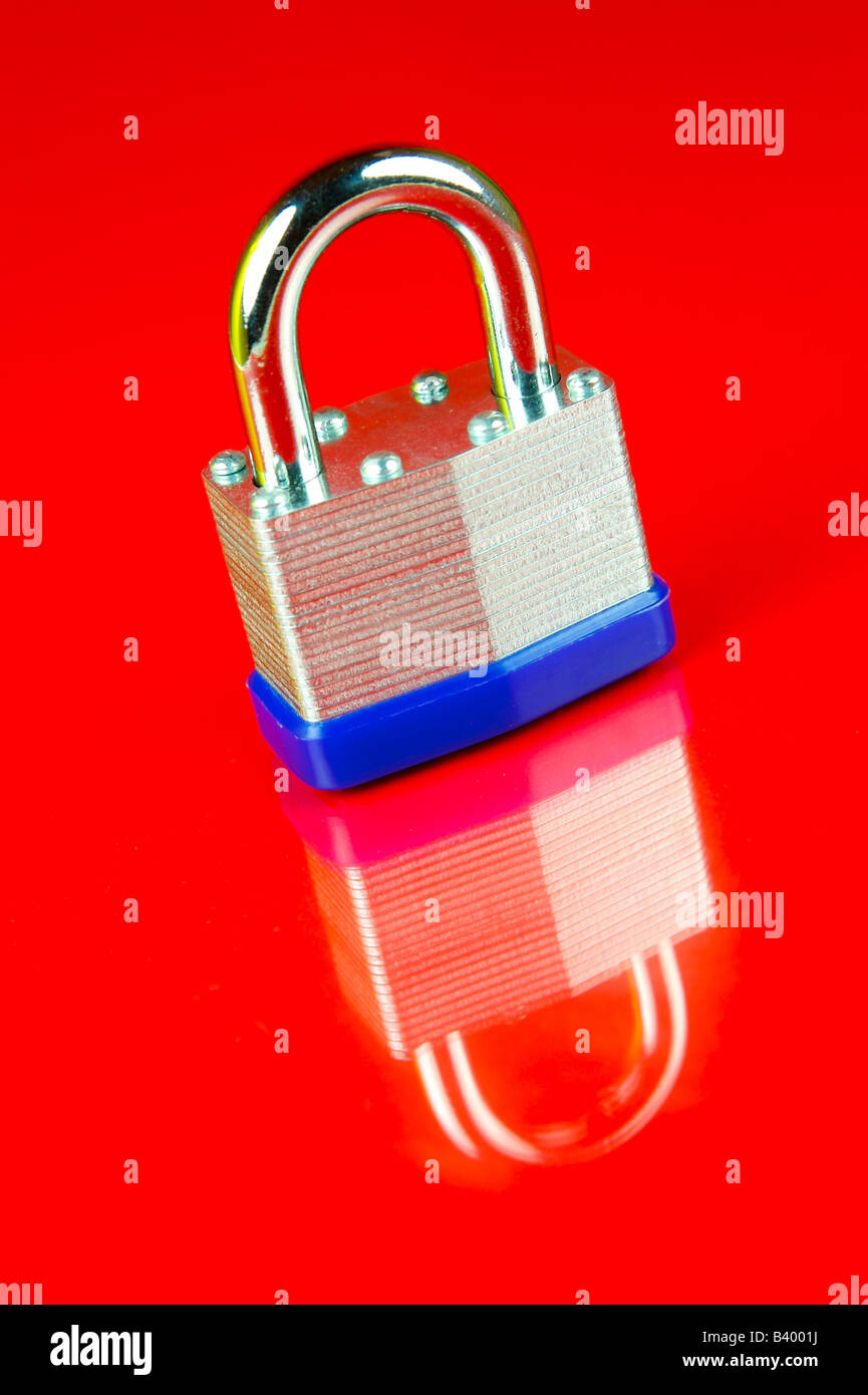 A padlock isolated against a red background Stock Photo - Alamy