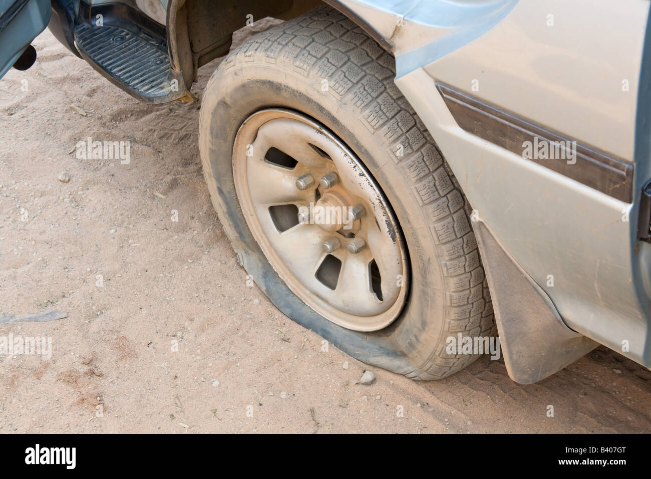 Car punctured hi-res stock photography and images - Alamy