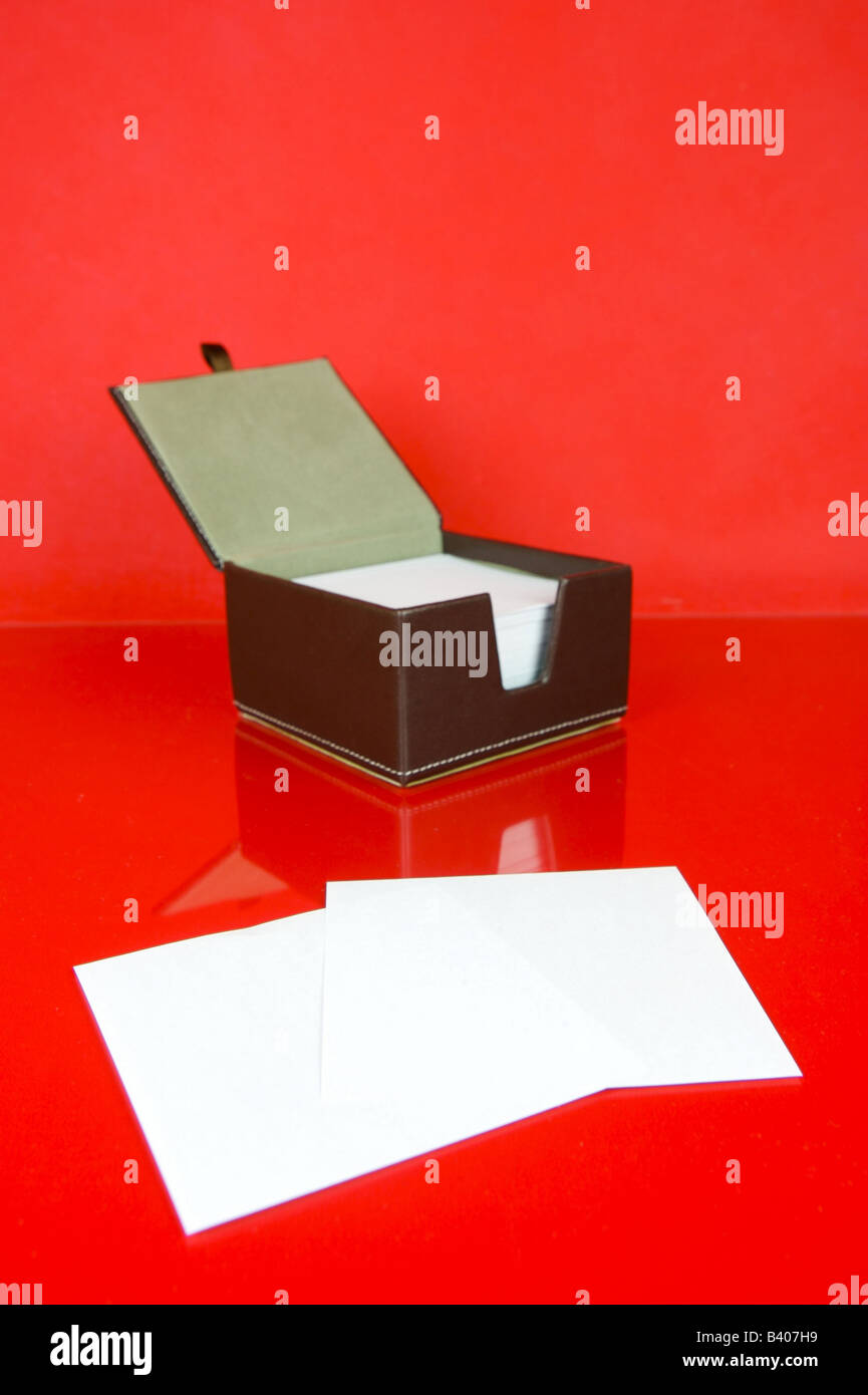 A note block isolated against a red background Stock Photo - Alamy