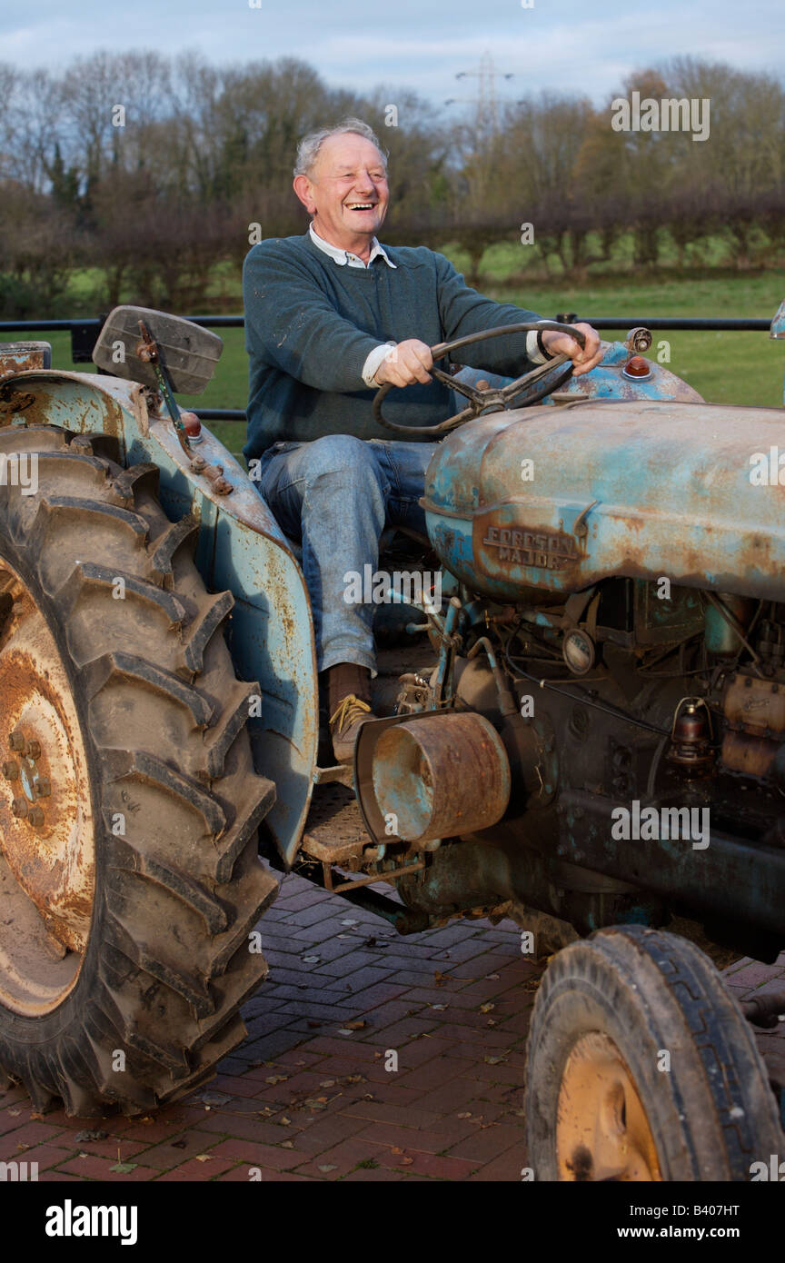 Happy Farmer on Fordson Major tractor Stock Photo - Alamy