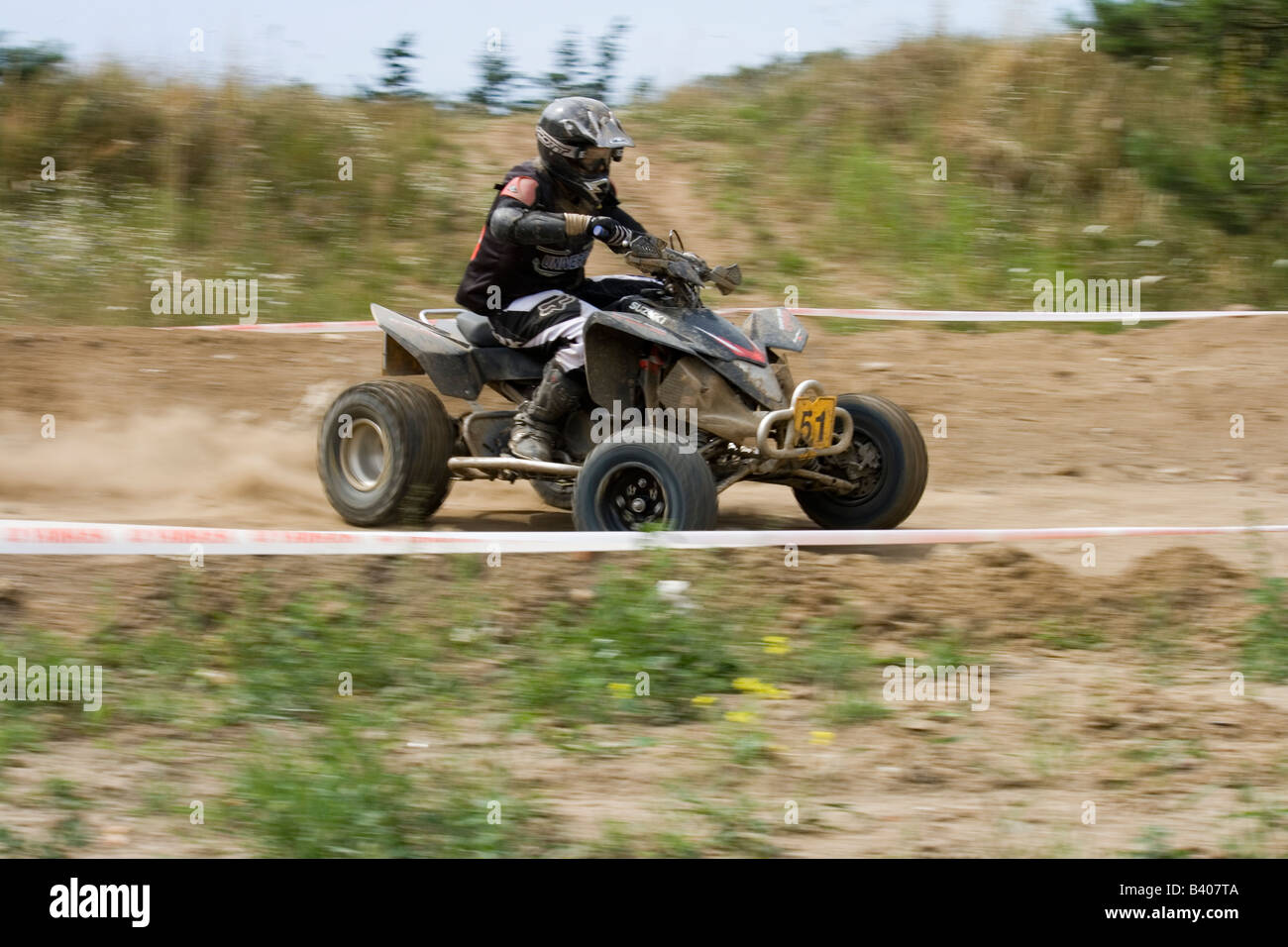 Quad rider during off road race Stock Photo - Alamy