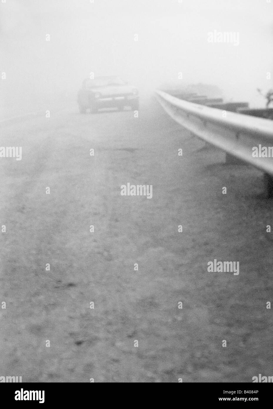 Car on street in fog Stock Photo - Alamy