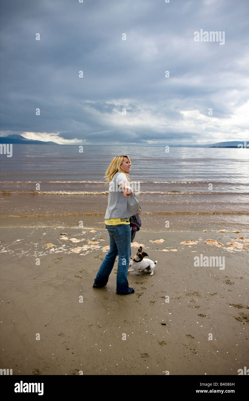 Woman throwing stone sea hi-res stock photography and images - Alamy