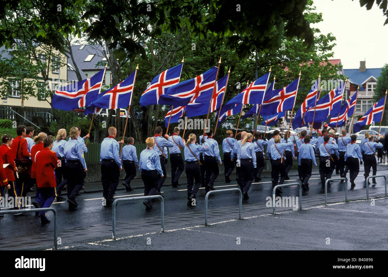 Group of people, boyscouts and girlscouts, walking in parade with ...