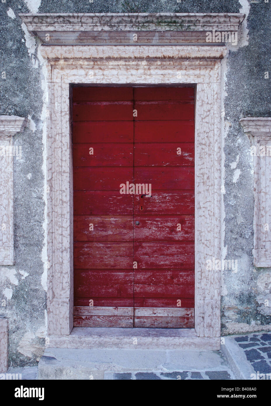 Weathered red door Stock Photo - Alamy