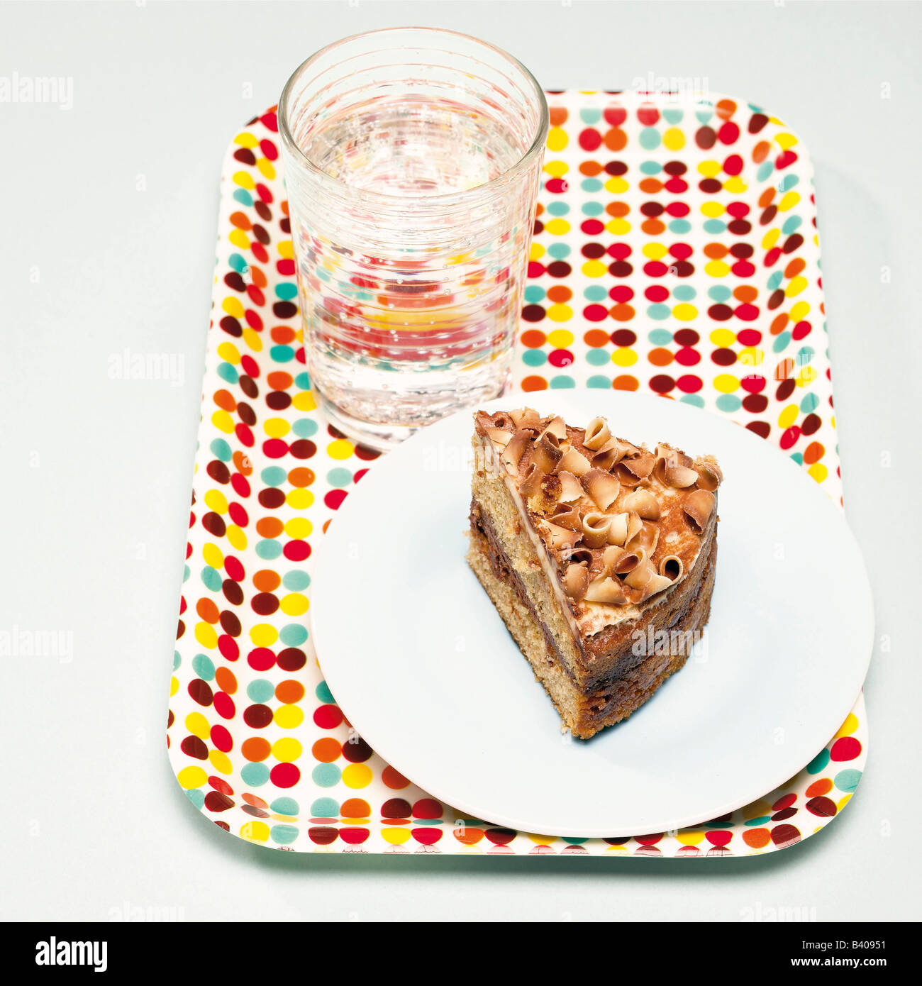 A tray with a glass of water and a pie slice Stock Photo - Alamy