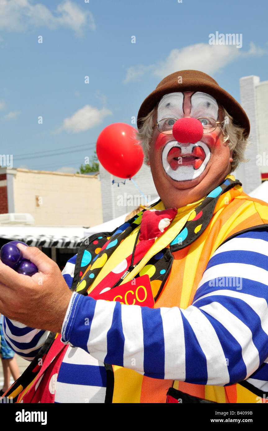 Smiling happy colorful clown Stock Photo - Alamy