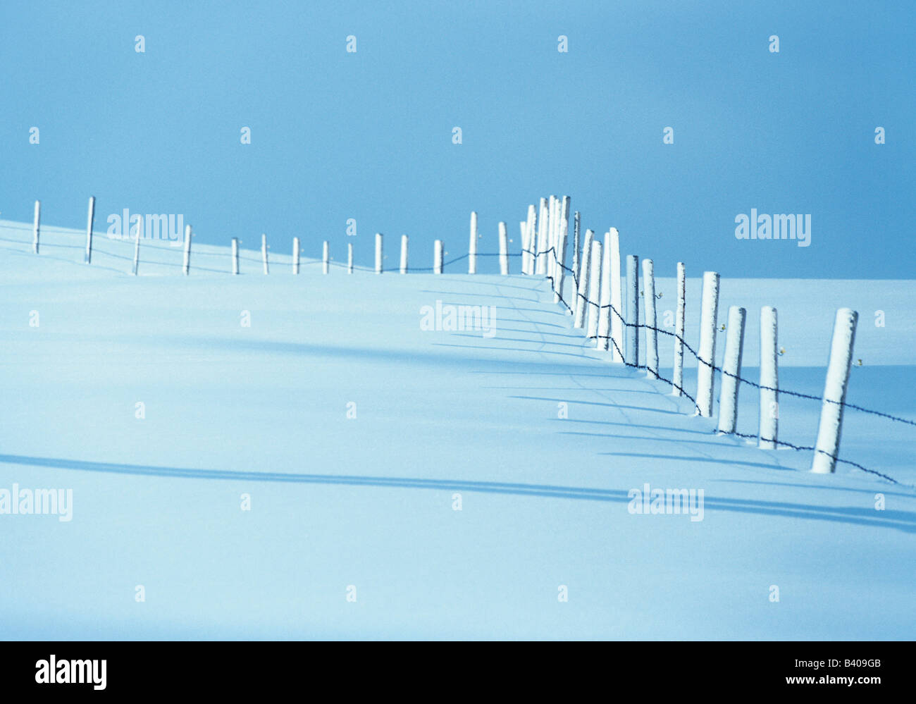 Fence in snow Stock Photo - Alamy