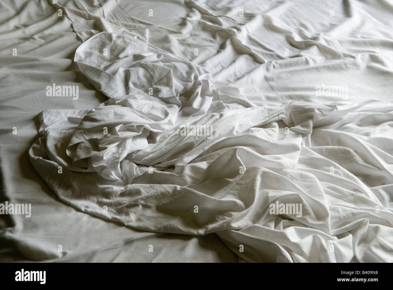 White bed sheets slept in, frowzled, disheveled an unmade bed. HOMER ...