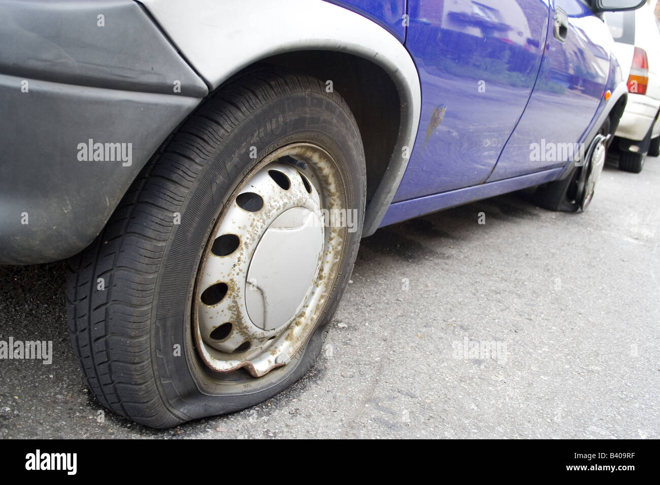 A small car that has had an accident damaging it s wheel rims Stock ...