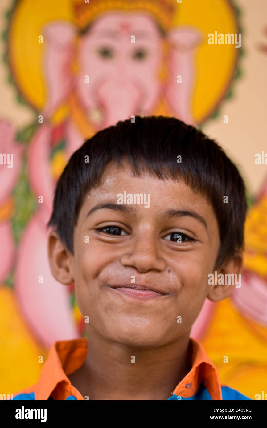 Portrait of a hindu boy in front of Ganesh image, Jaisalmer, Rajasthan ...