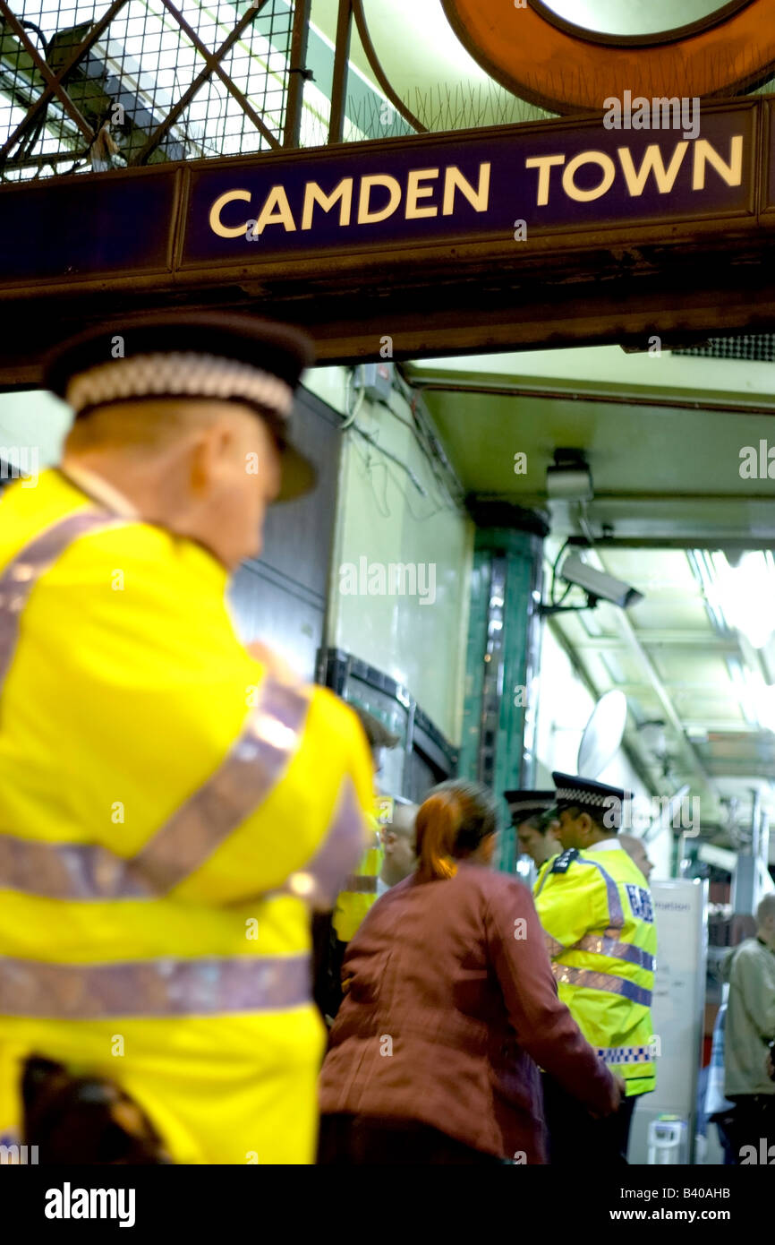 Police officers at camden tube station at night Stock Photo - Alamy