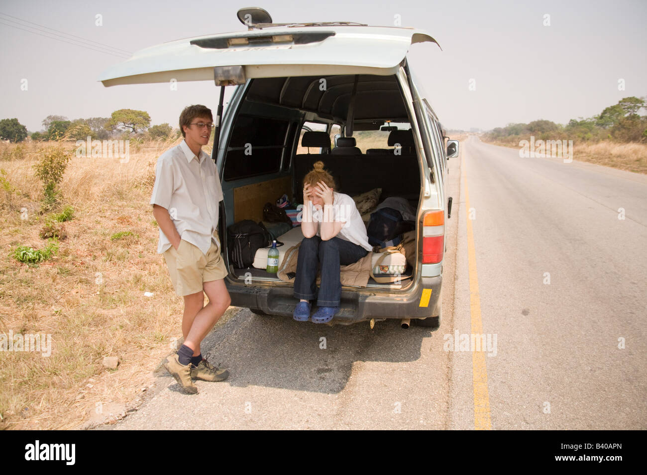 Car sick woman on the roadside Zambia Africa Stock Photo - Alamy