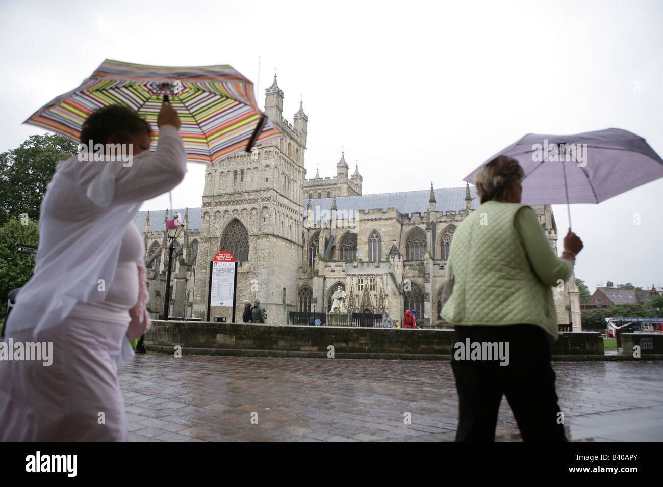 People in Exeter in the rain Stock Photo - Alamy