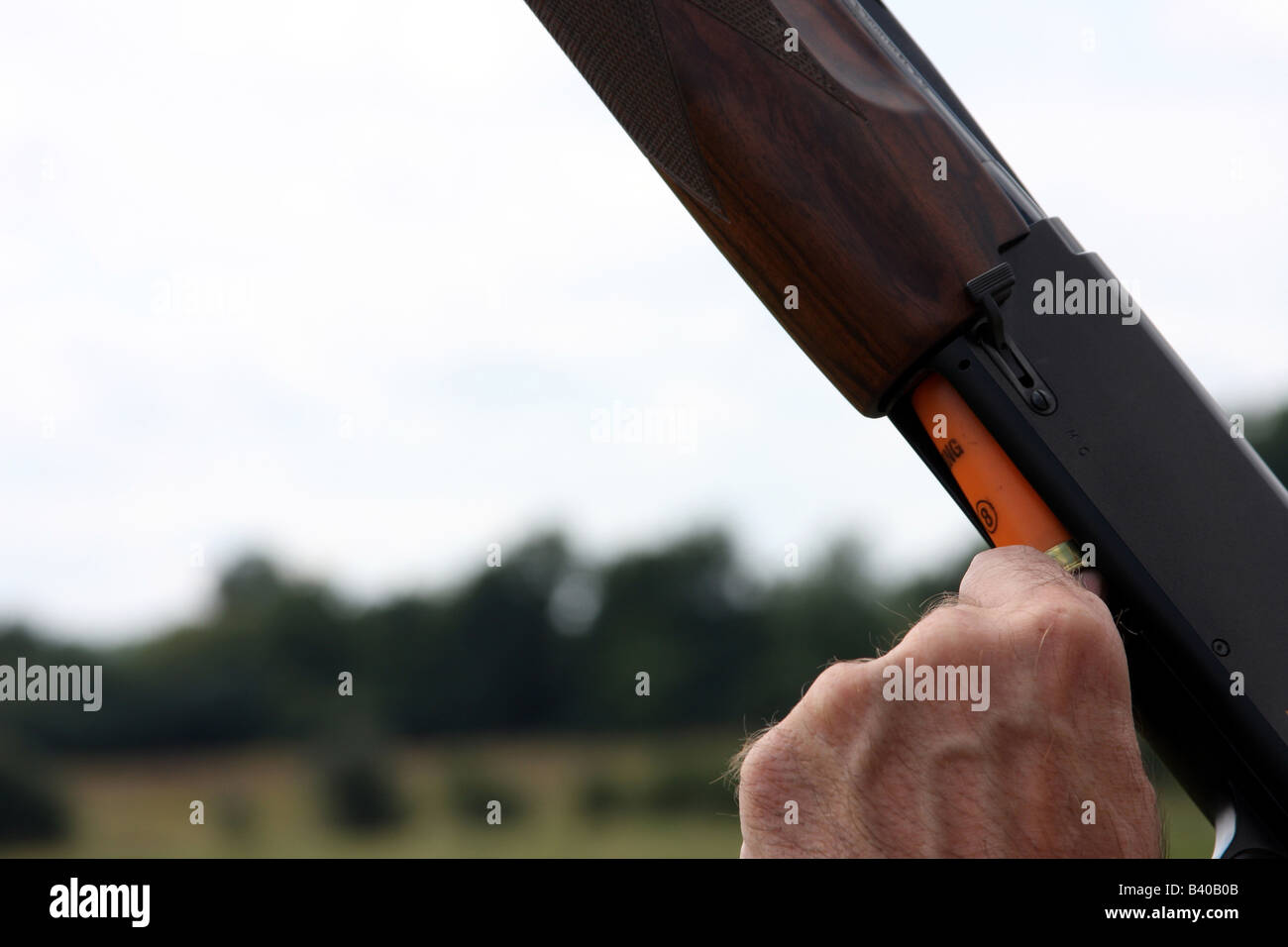Cartridges being loaded into a rifle at a skeet shooting range in ...