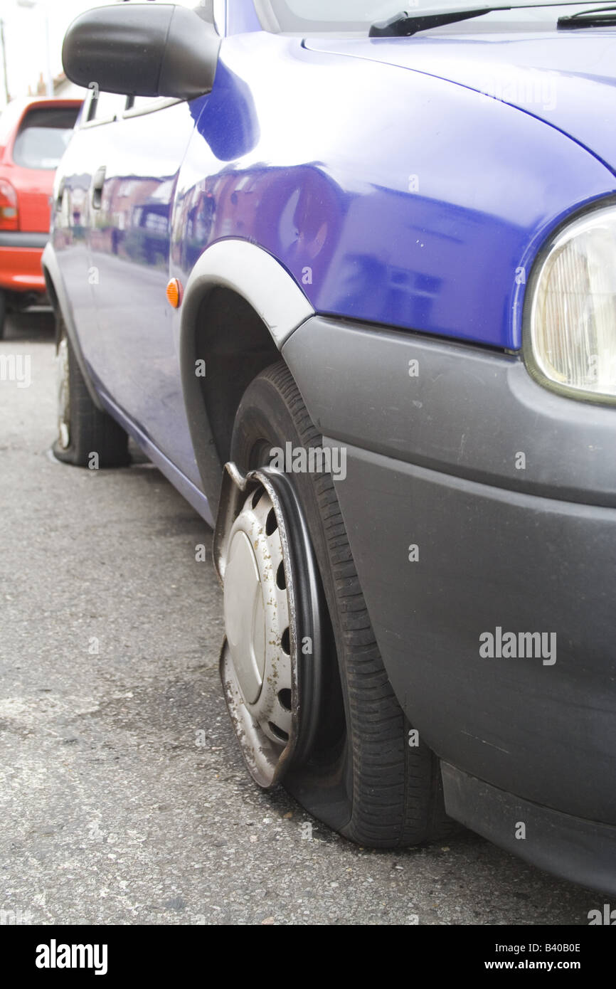 A small car that has had an accident damaging it s wheel rims Stock ...