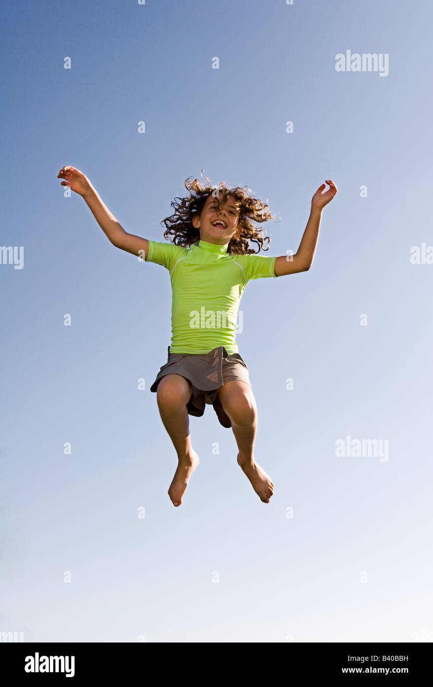 Girl jumping free air Stock Photo - Alamy