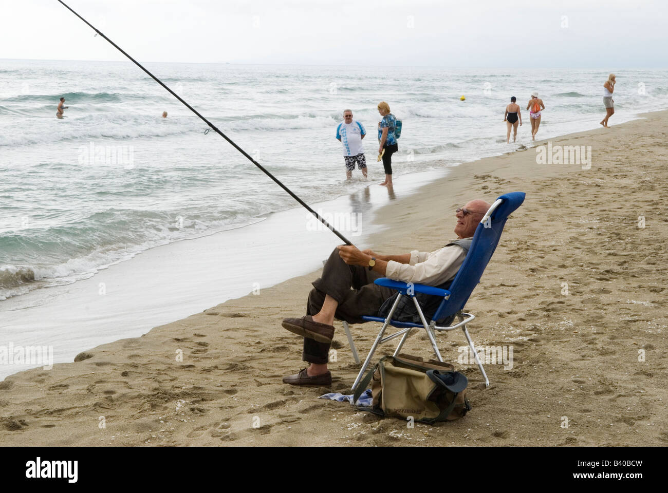 Sea fishing elderly man beach senior seniors active older oap Canet ...