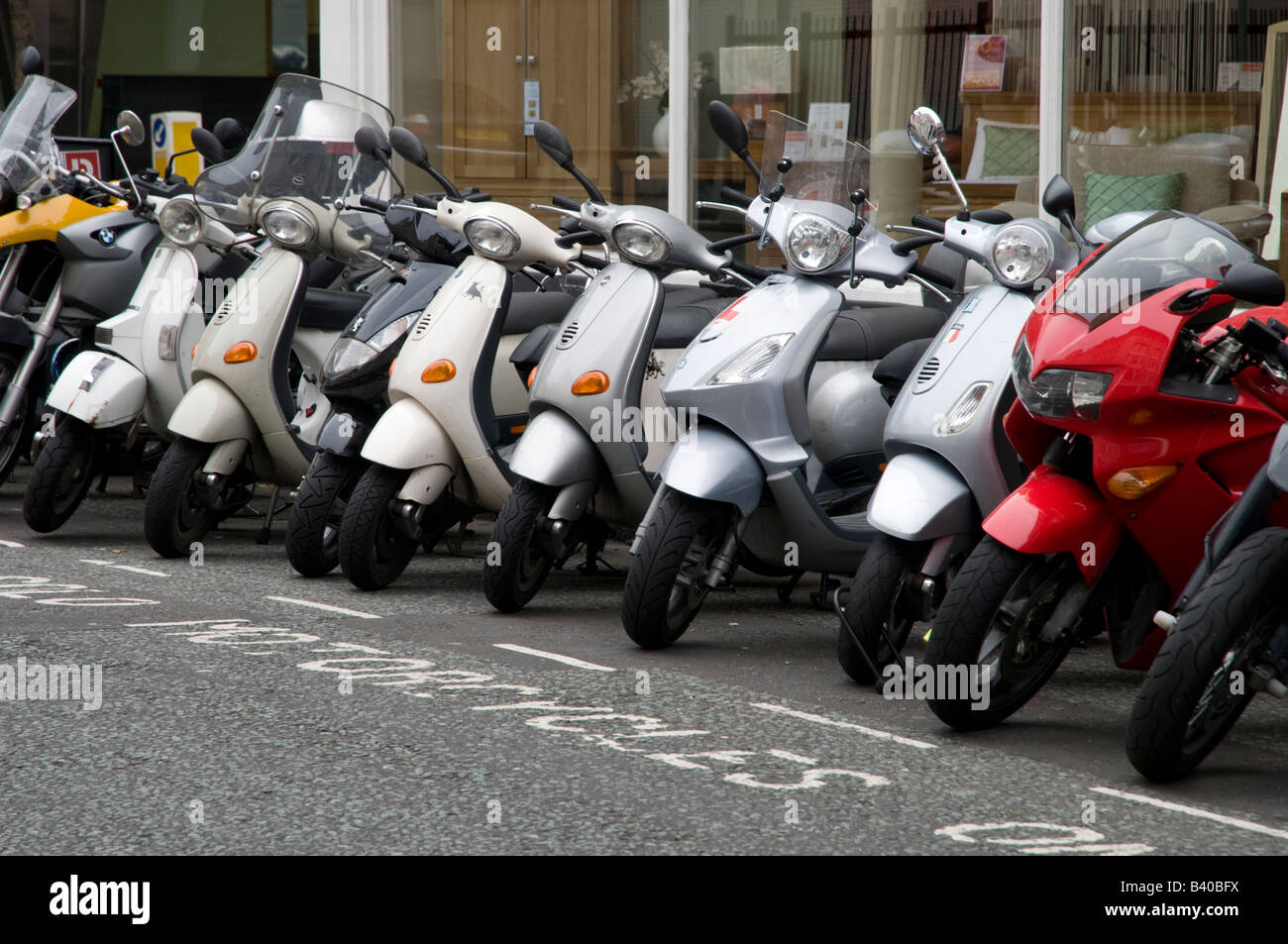 Mopeds parked in motorcycle bay, London, UK Stock Photo - Alamy