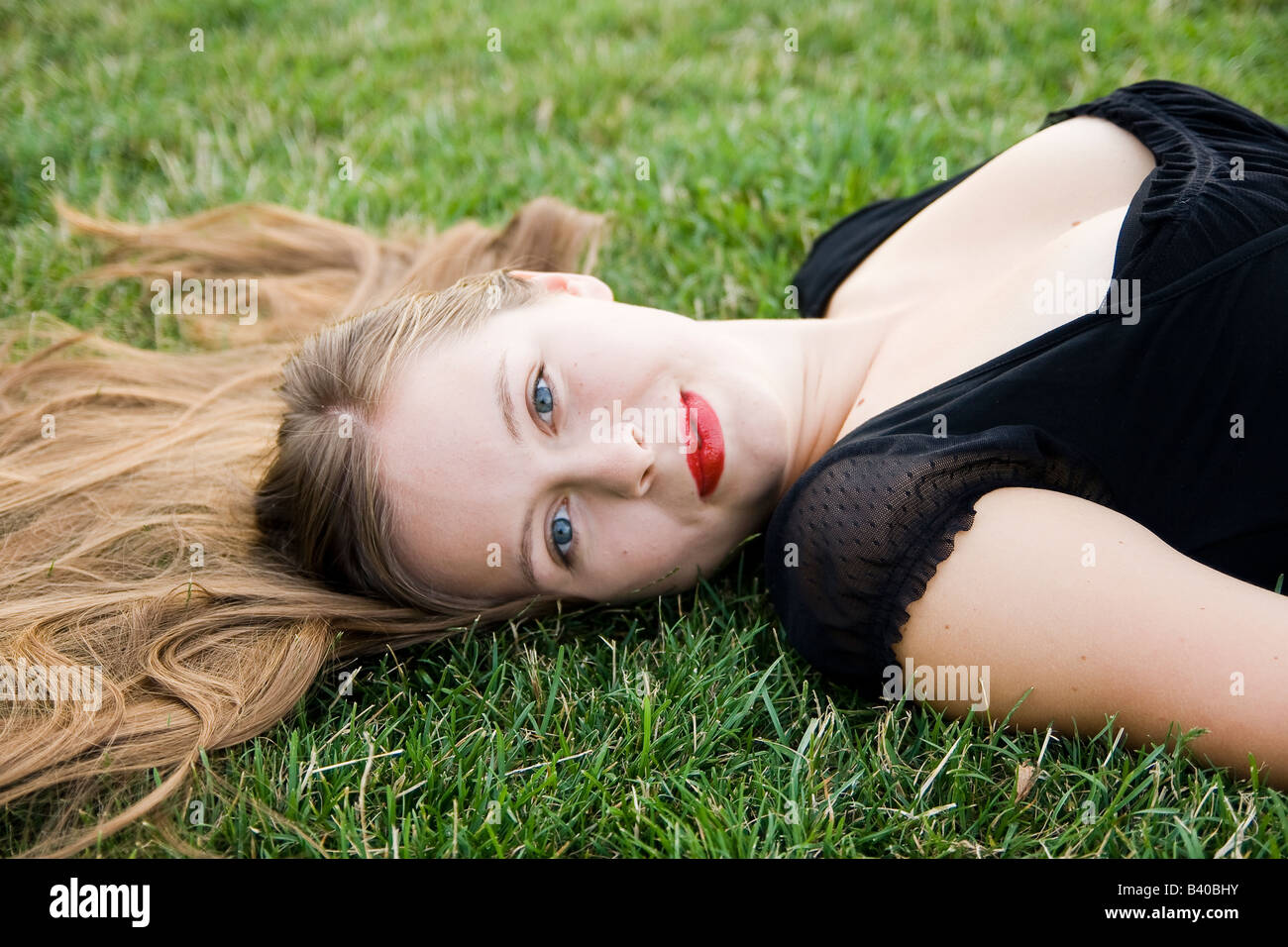 young girl on green lawn Stock Photo - Alamy