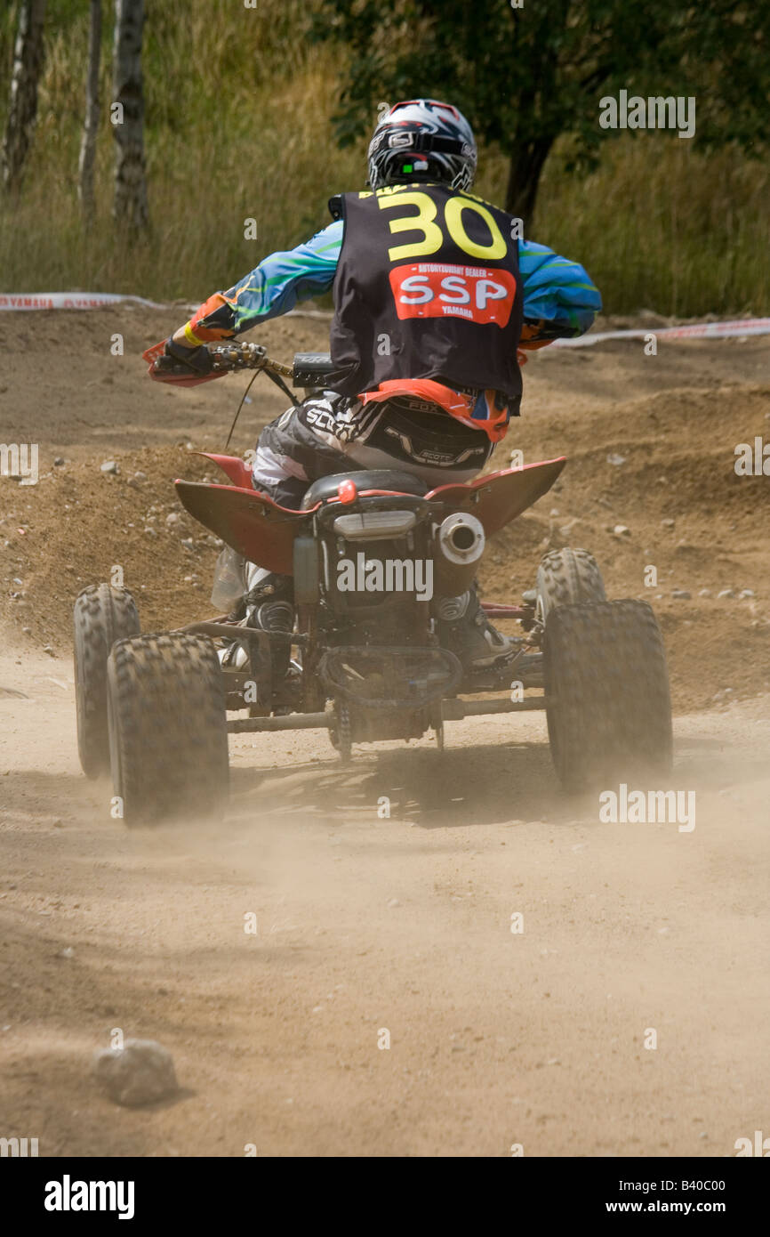 Quad rider during off road race Stock Photo - Alamy