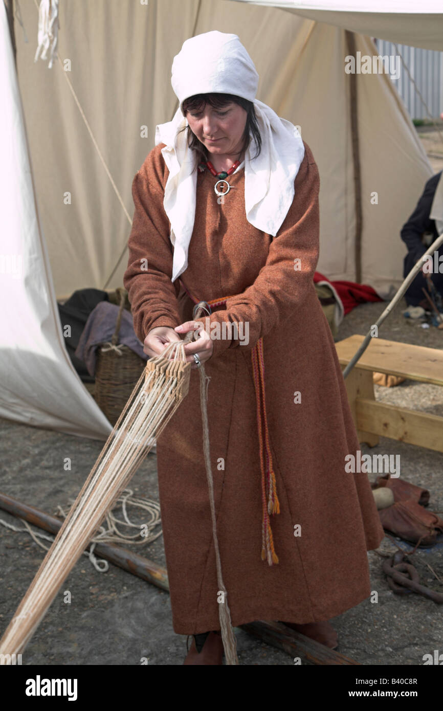Viking woman weaving twine making string rope Stock Photo - Alamy