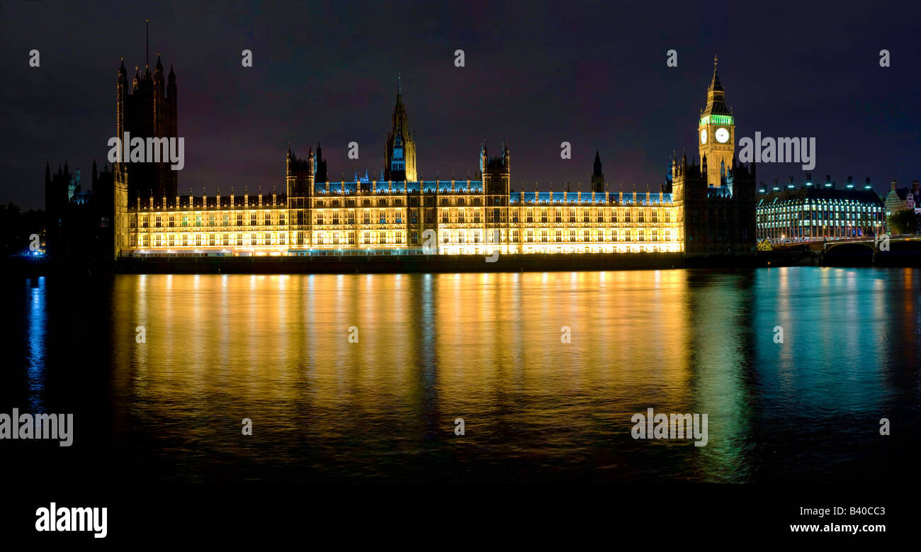 British Houses of Parliament at night with reflection on the River ...