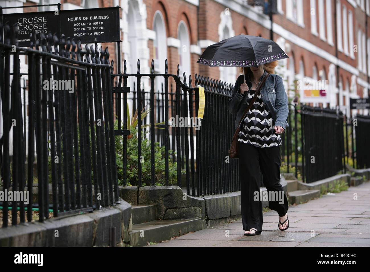 People in Exeter in the rain Stock Photo - Alamy