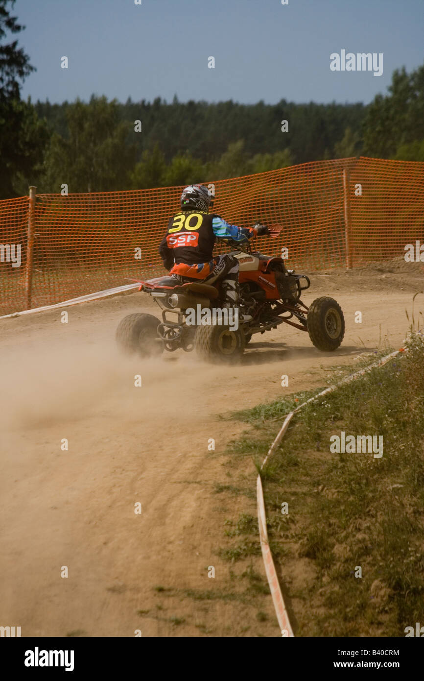 Quad rider during off road race Stock Photo - Alamy