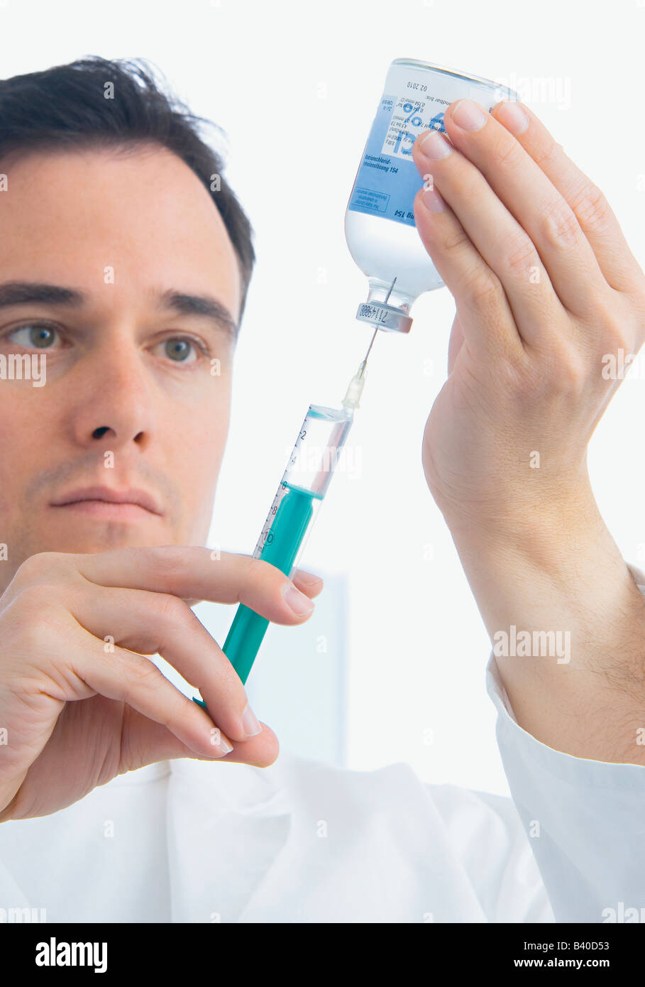 Doctor preparing syringe Stock Photo - Alamy