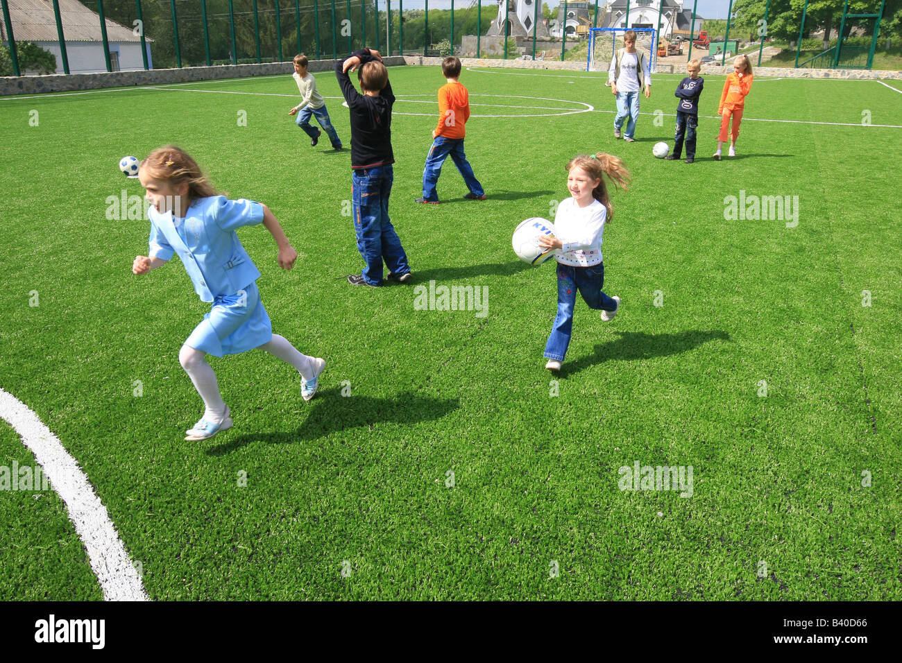Children play with a ball Stock Photo - Alamy