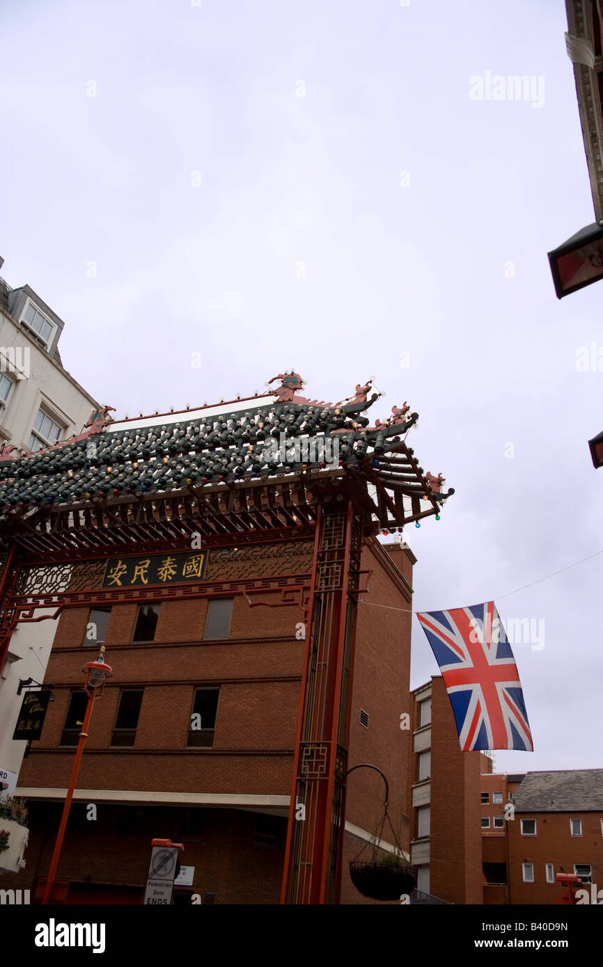 Union Jack flag flying above the traditional Chinese gate at the ...