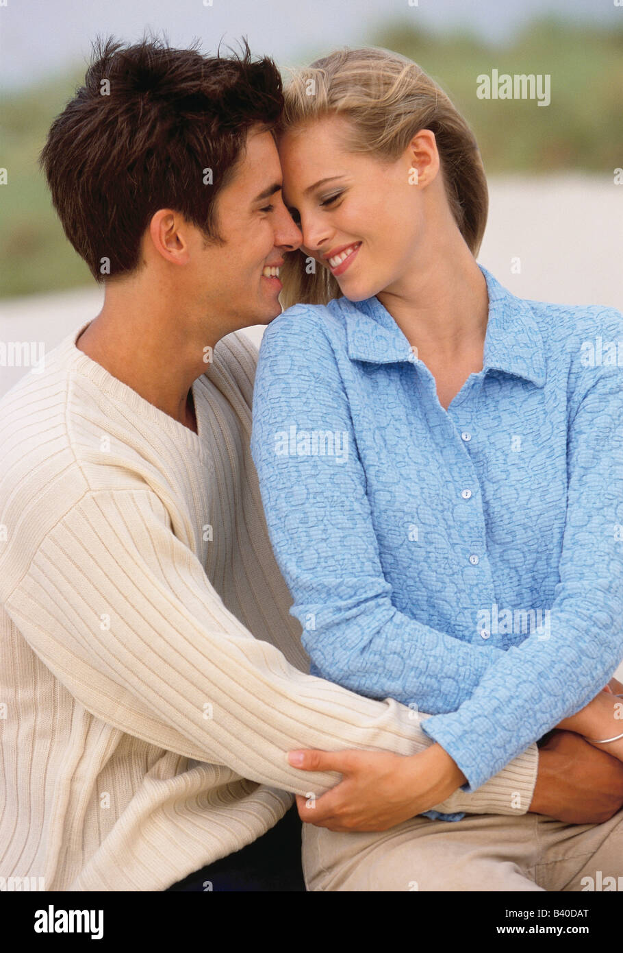 Young couple face to face embracing each other Stock Photo - Alamy