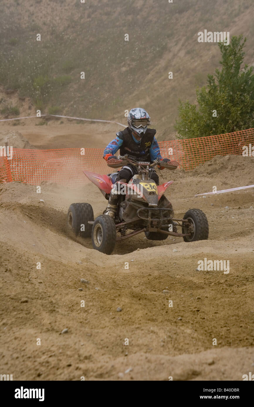 Quad rider during the cross country race Stock Photo - Alamy
