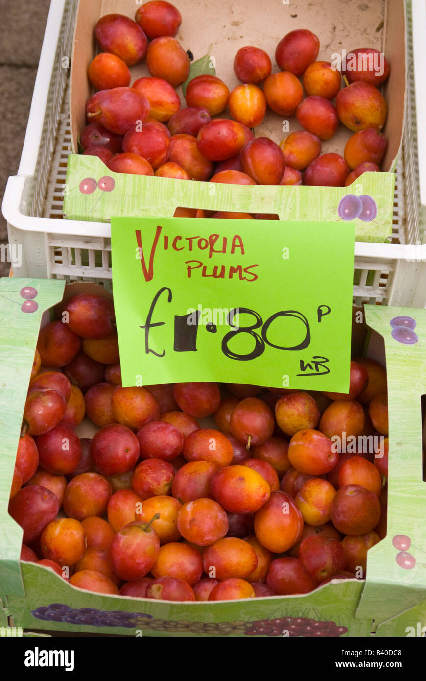 Victoria plums for sale outside Uk greengrocers Stock Photo - Alamy