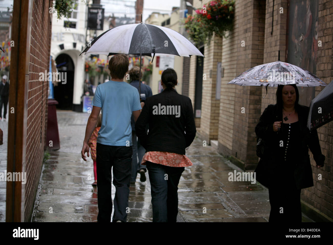 People in Exeter in the rain Stock Photo - Alamy
