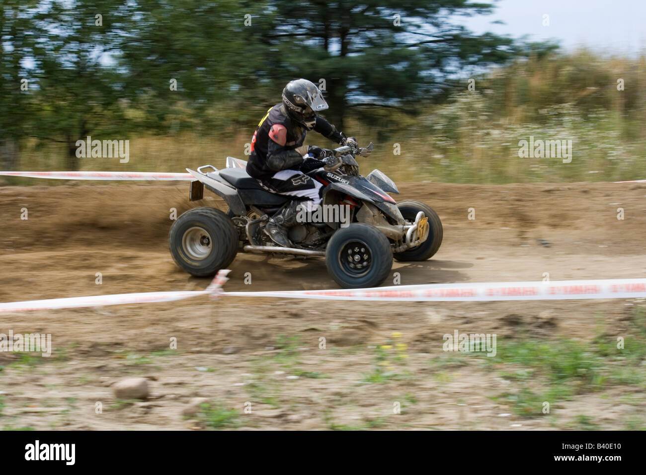 Quad rider during off road race Stock Photo - Alamy